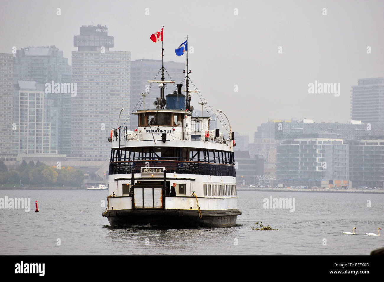A Toronto ferry boat traveling between Centre Island and Downtown ...