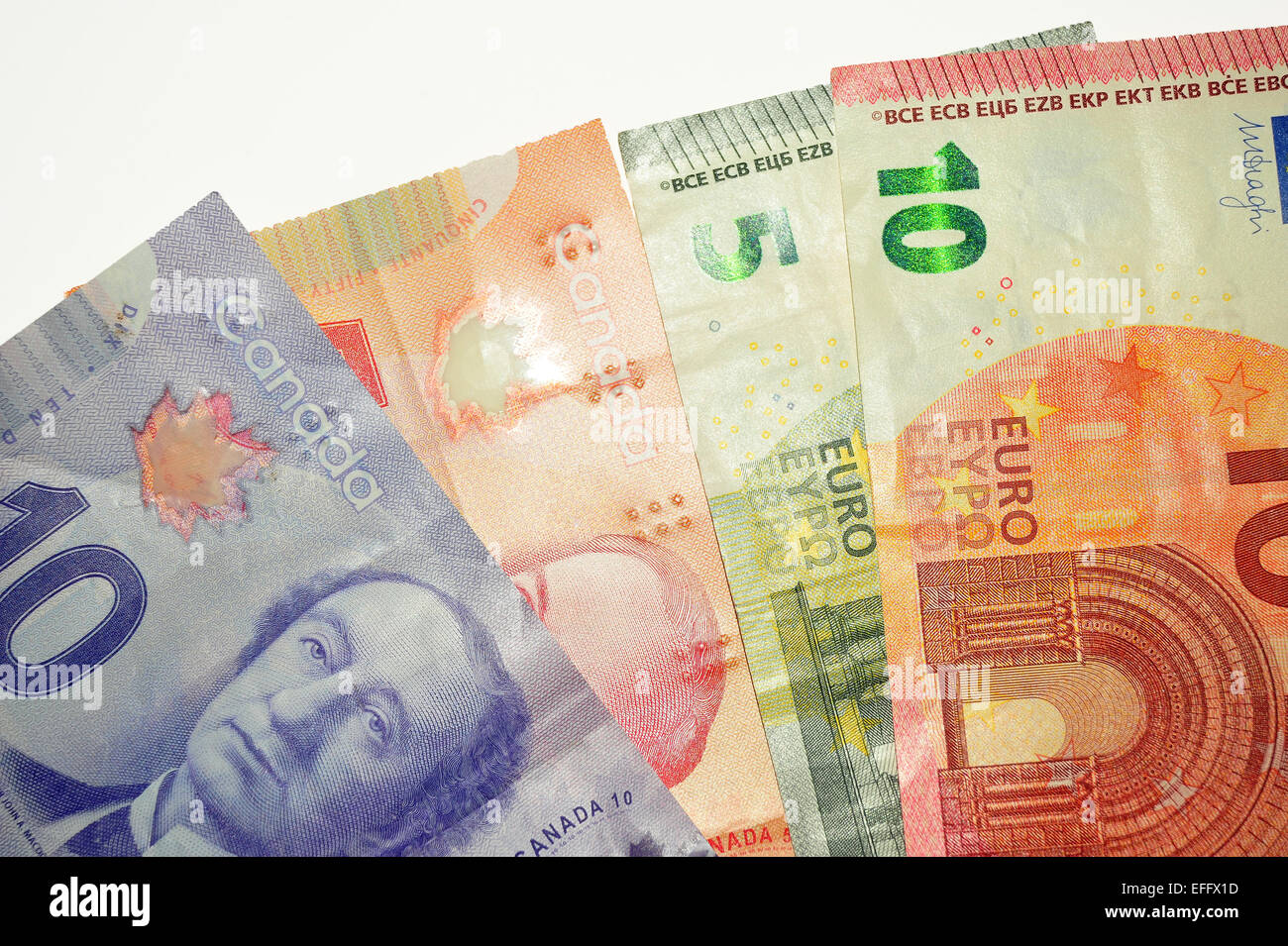 Canadian Dollar notes and European Euro notes photographed together ...