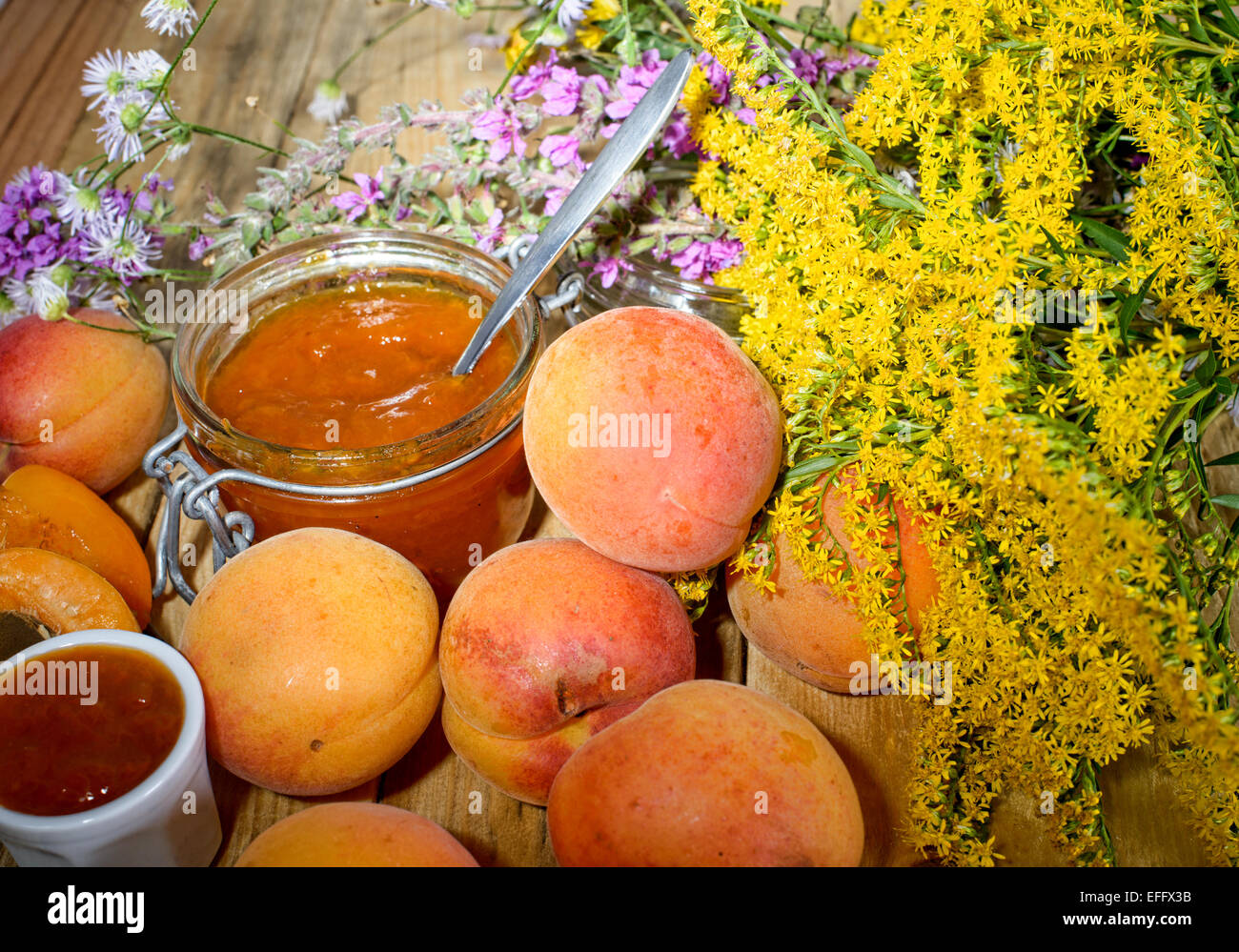 apricot jam with fruit and yellow flowers Stock Photo - Alamy
