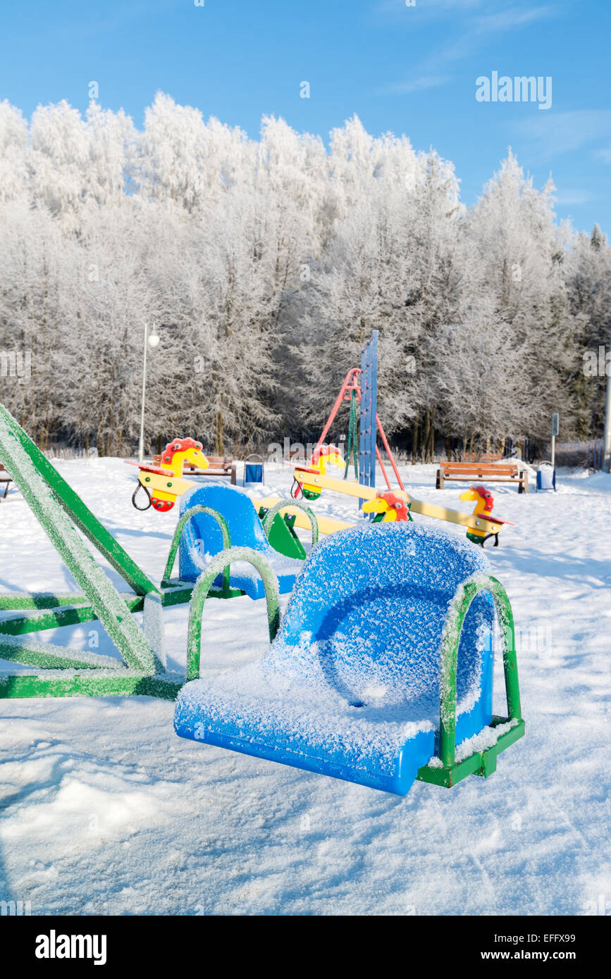 snow covered swing and slide at playground Stock Photo - Alamy