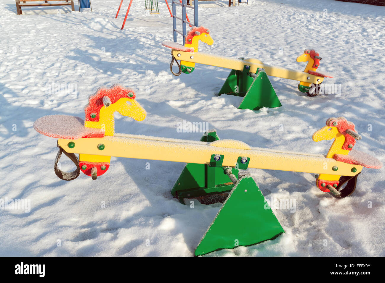 snow covered swing and slide at playground in winter Stock Photo - Alamy
