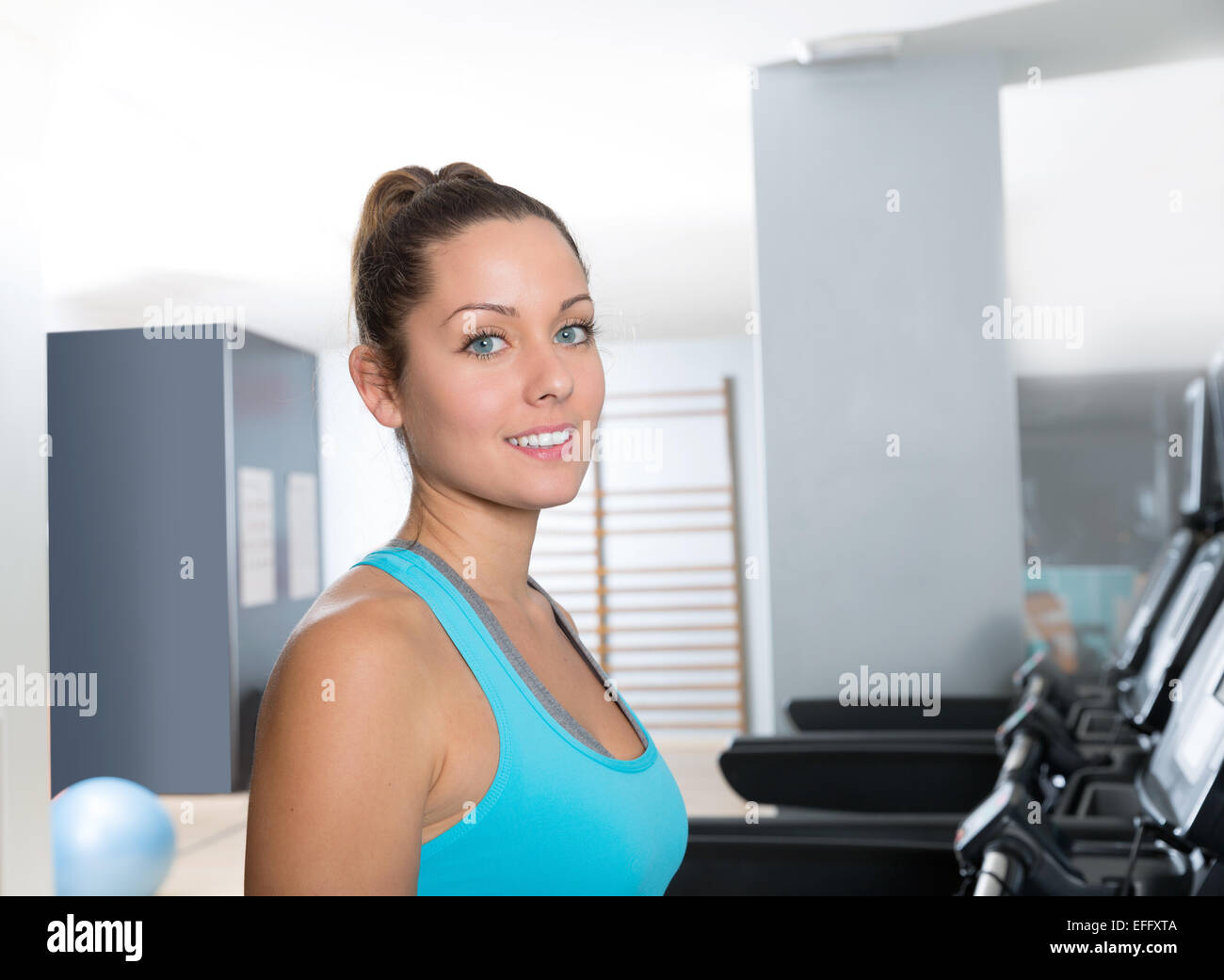 Gym treadmill women indoor exercise blue eyes girl smiling Stock Photo ...