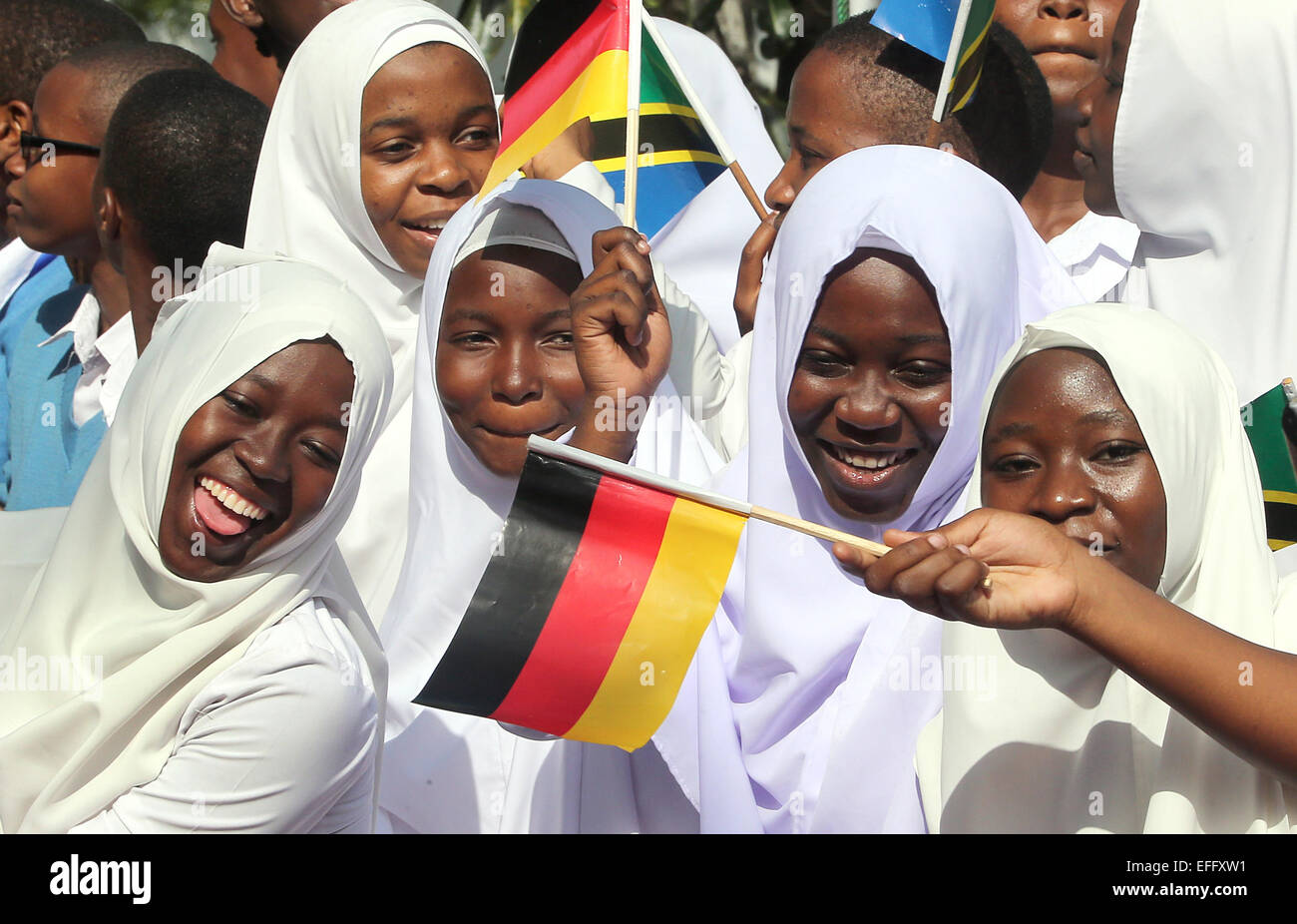 Young people greet German President Gauck with flags in Dar es Salaam ...