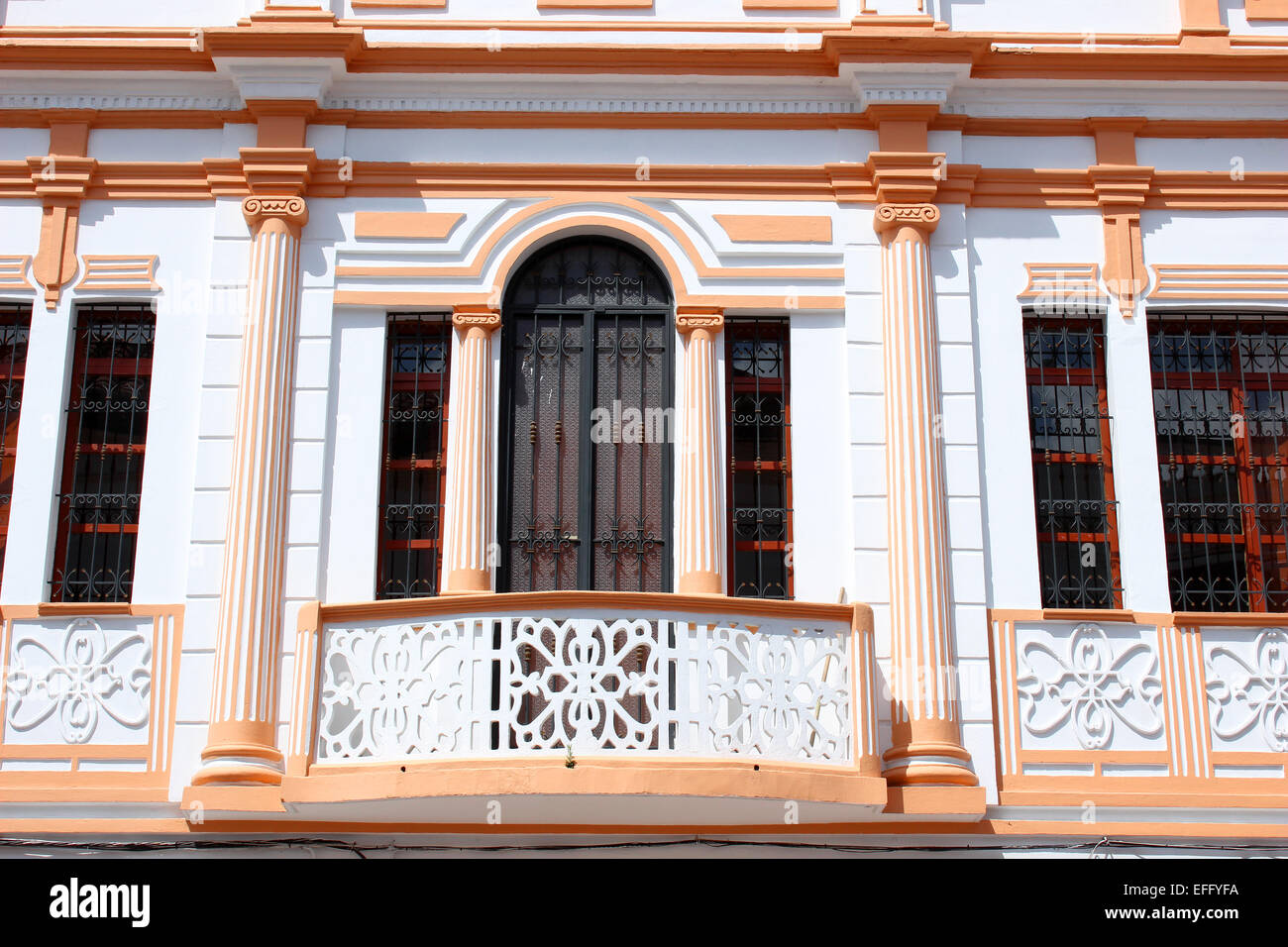 A balcony and pillars on the facade of a building in the historic ...