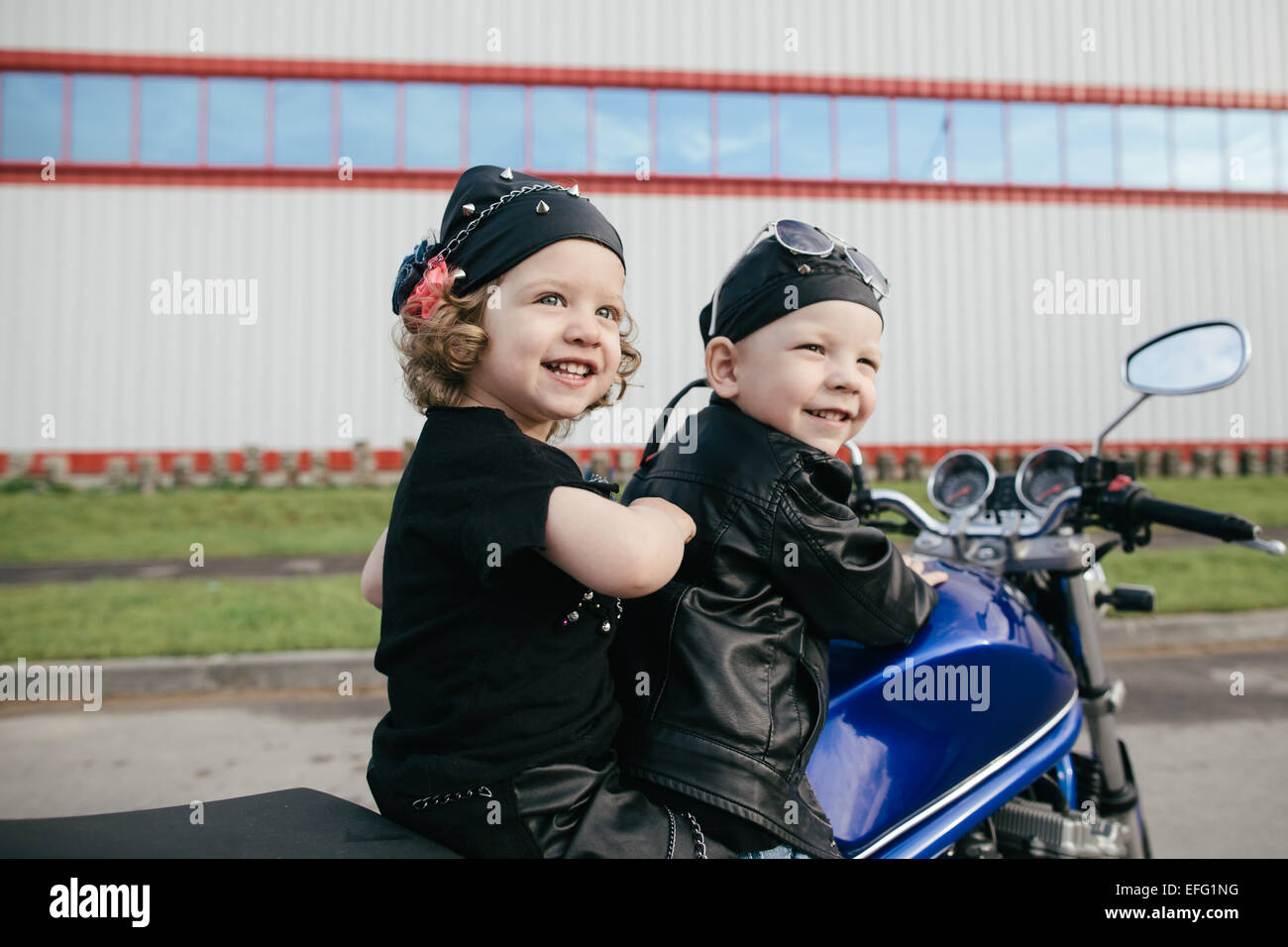 little bikers on road with motorcycle Stock Photo - Alamy