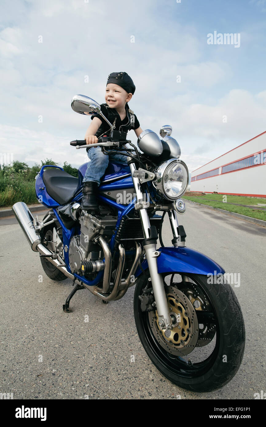 little biker on road with motorcycle Stock Photo - Alamy