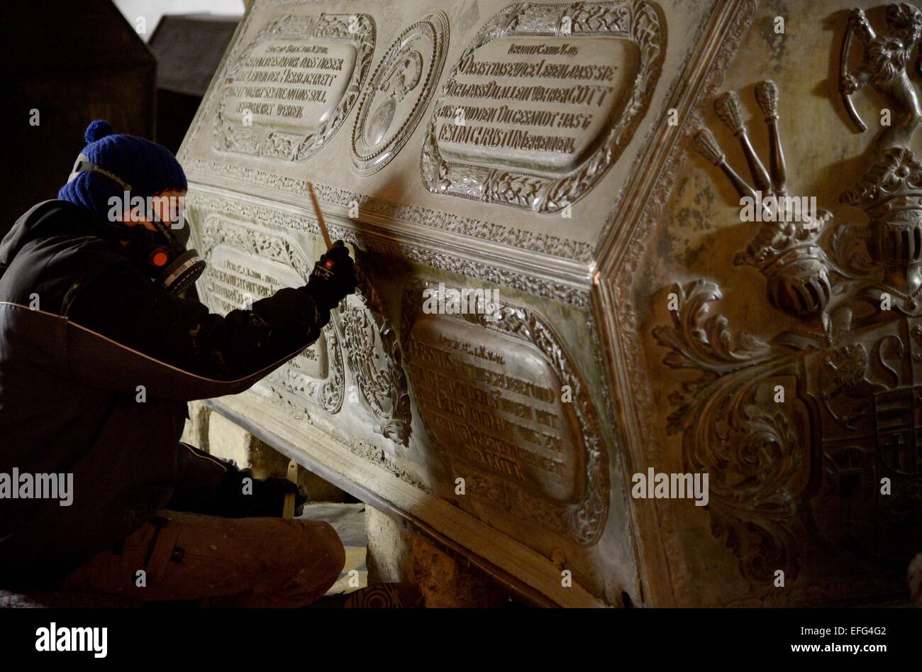 Wolfenbuettel, Germany. 19th Jan, 2015. A restorer works on the zinc ...