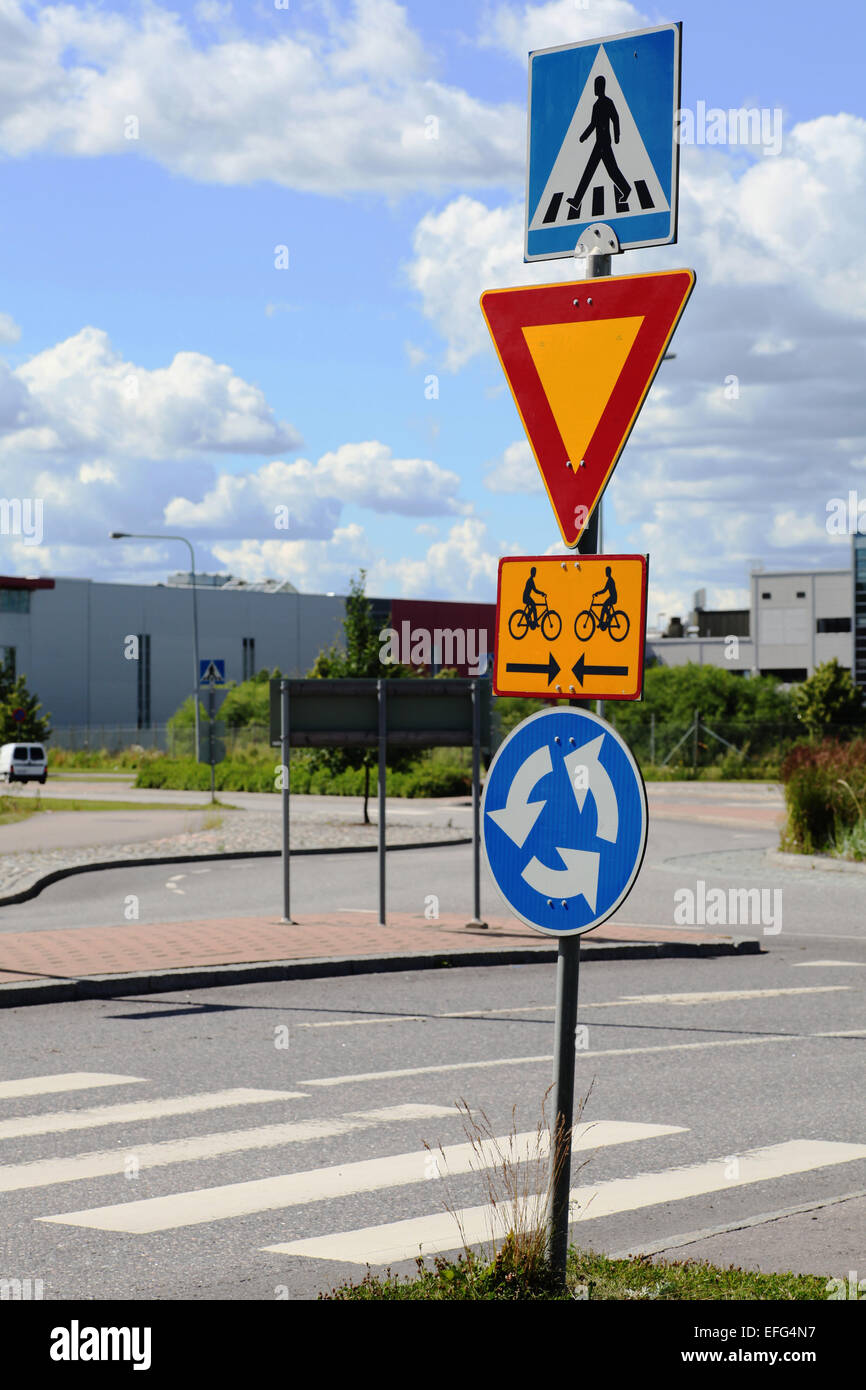 road signs at intersection roundabout, give way Stock Photo - Alamy
