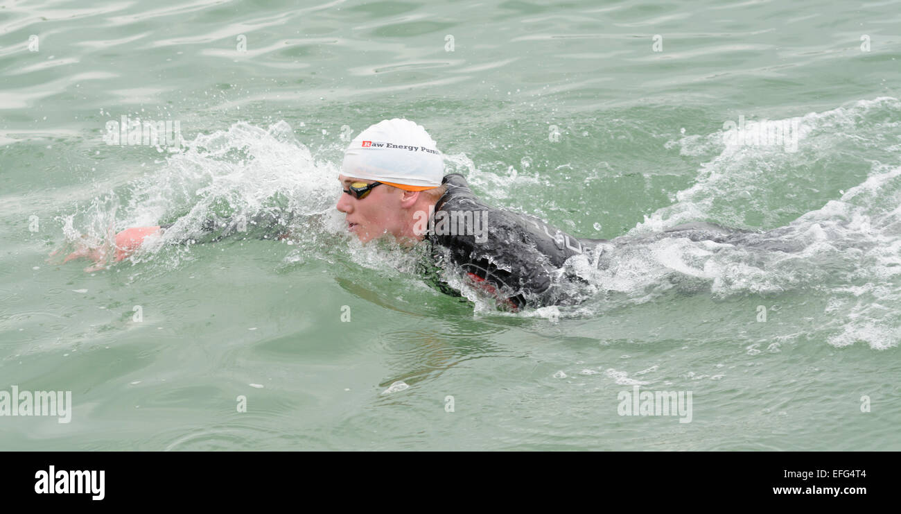 Swimming in a river in waterproof swimwear and cap Stock Photo - Alamy