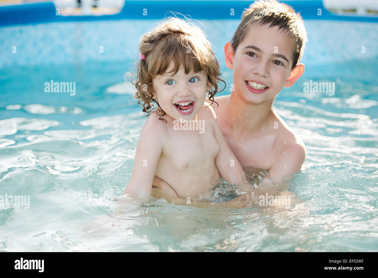 brother and sister in the pool Stock Photo - Alamy