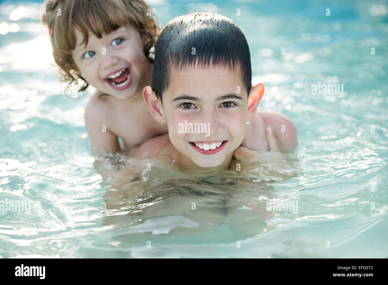 Brother sister together in pool hi-res stock photography and images - Alamy