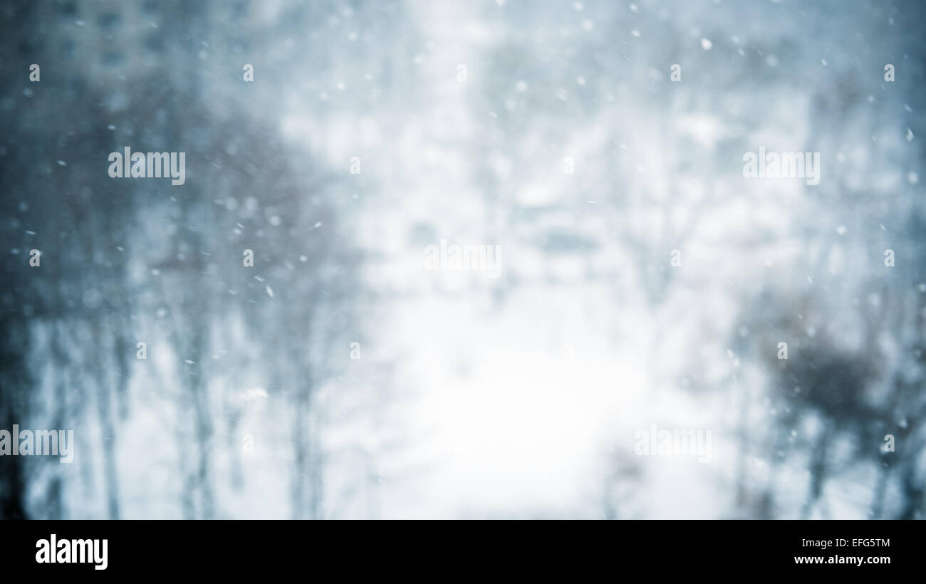 Winter blur background with snowflakes in motion Stock Photo - Alamy