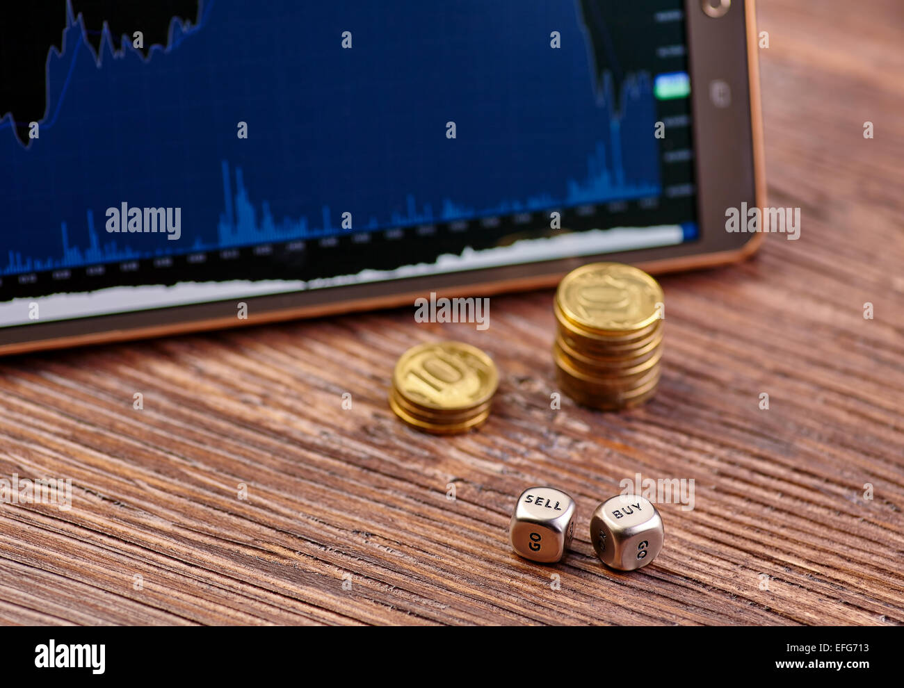 Coins, tablet, dices cubes, financial chart.Selective focus Stock Photo ...