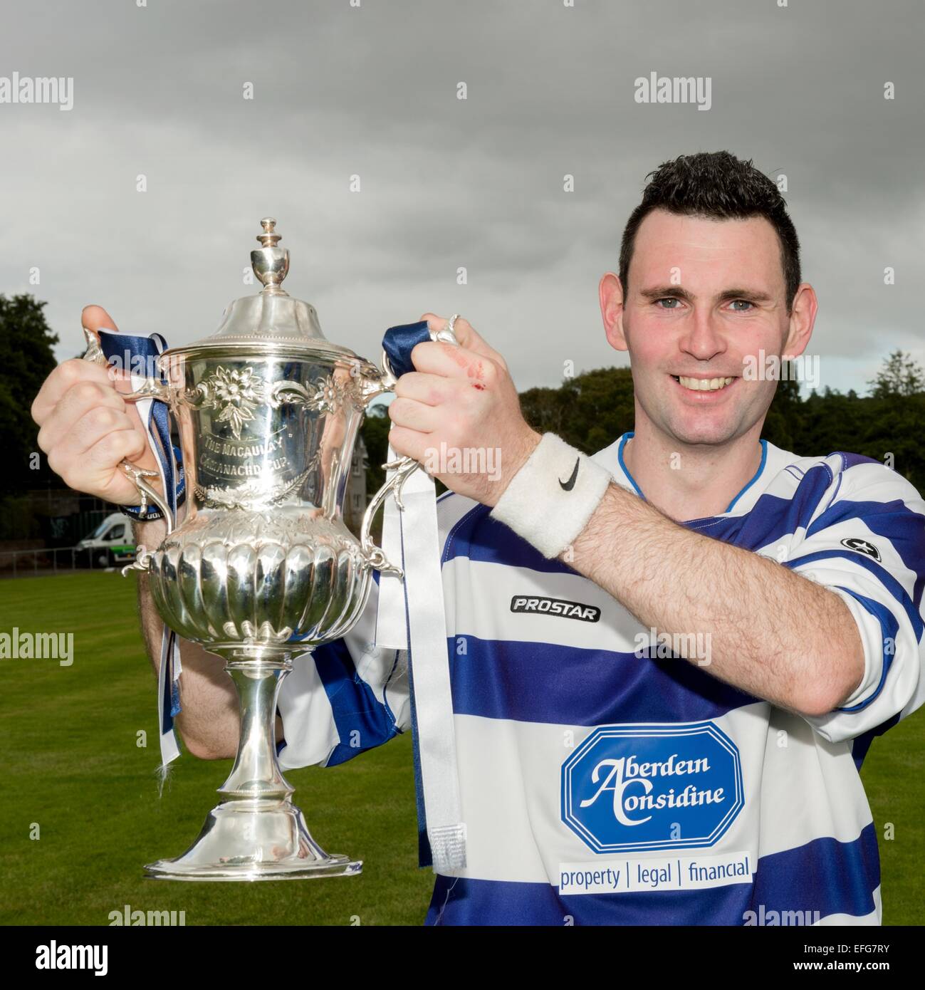 Newtonmore captain Scott Chisholm with the cup after beating Kyles ...