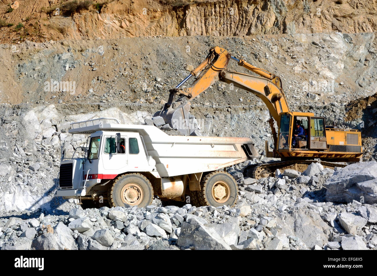 Vehicles involved in a mine extraction of talc Stock Photo - Alamy