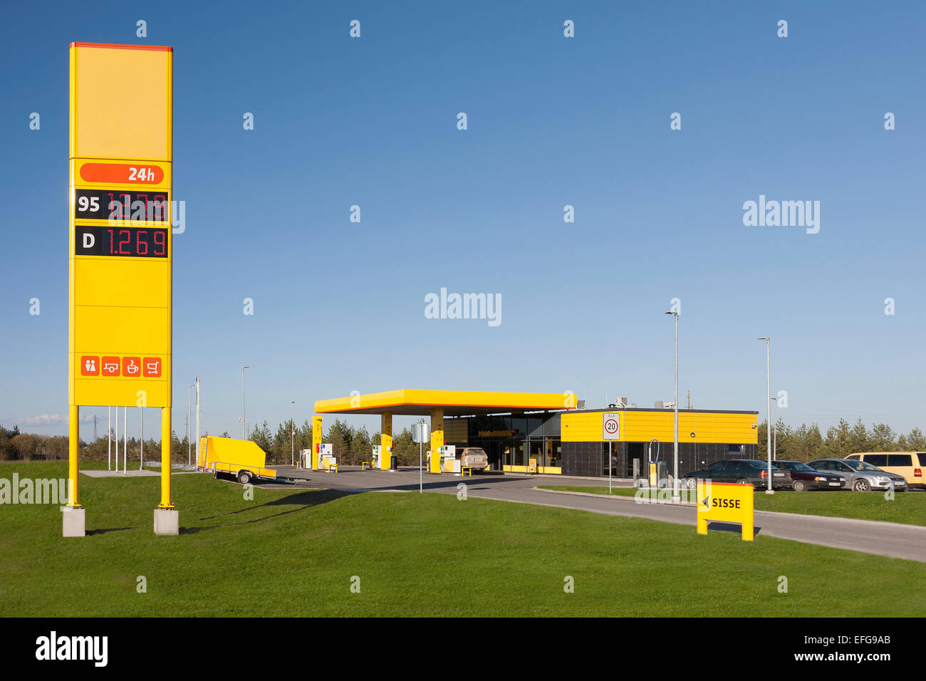 Gas station with price post and convenience store Stock Photo - Alamy