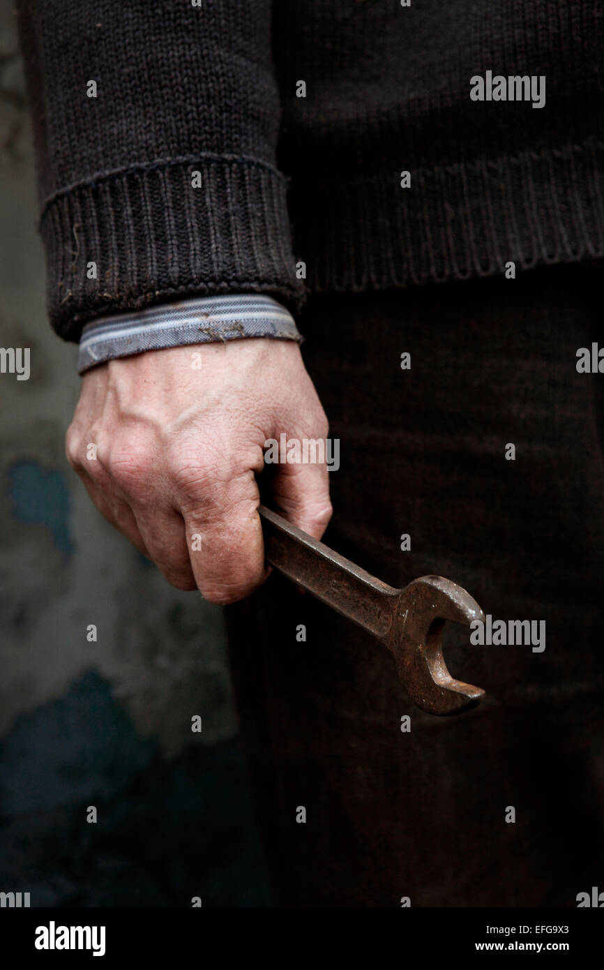 Person holding a wrench hi-res stock photography and images - Alamy