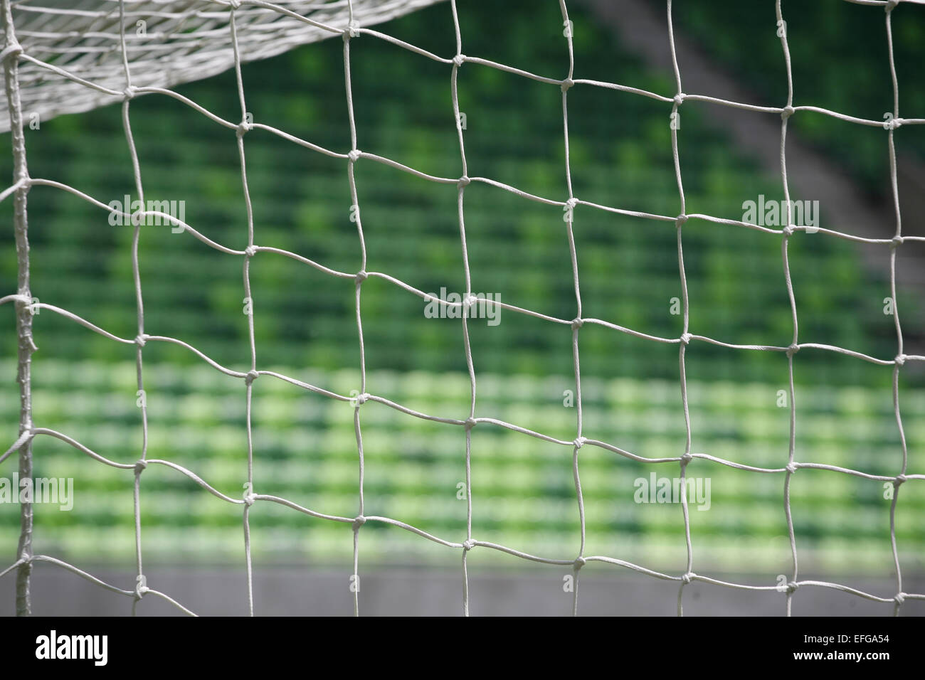 Soccer goal and net in green stadium. White soccer net with green grass ...