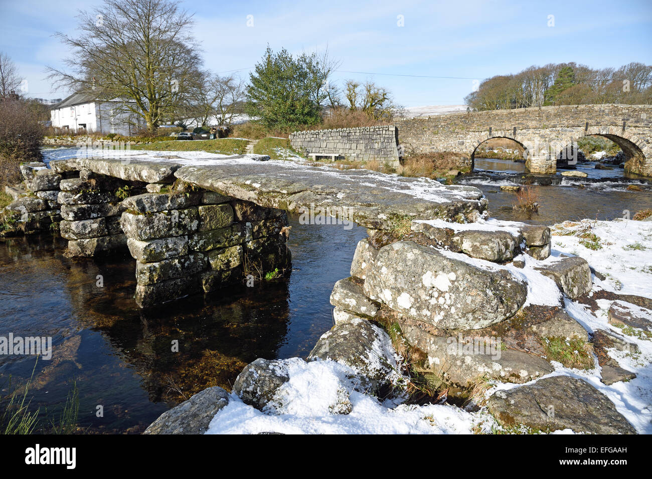 Winter view of the ancient Clapper Bridge at Postbridge, Dartmoor ...