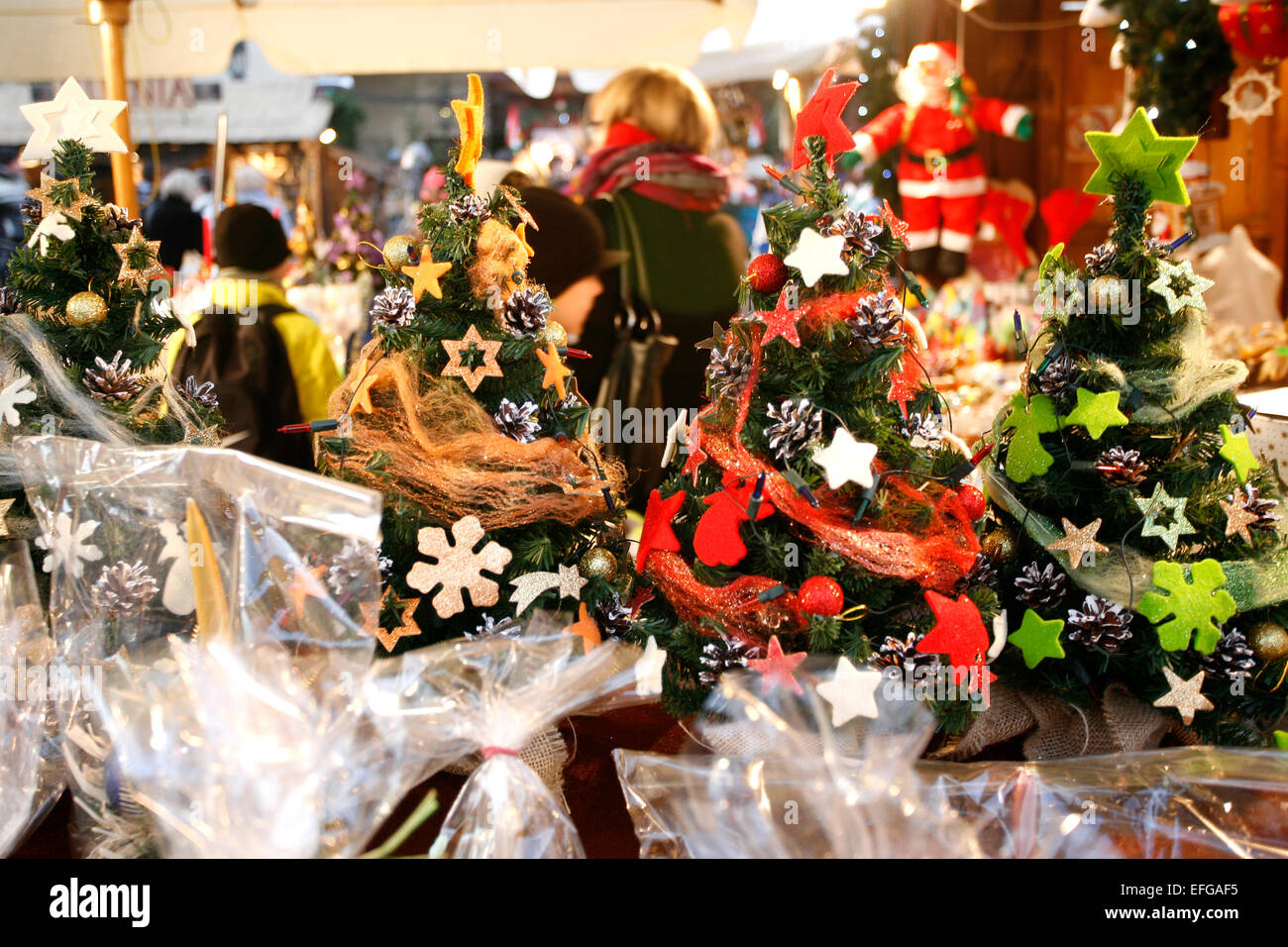 Christmas market stall with small colorful pine trees Stock Photo - Alamy
