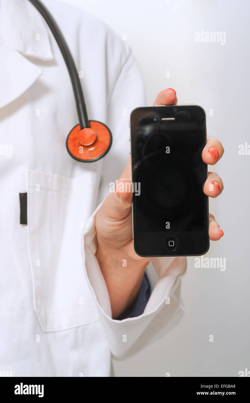 Doctor using and presenting smartphone Stock Photo - Alamy