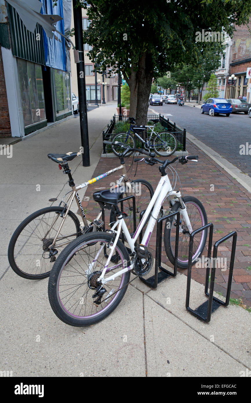 Bicycles parked in racks along the street Stock Photo - Alamy