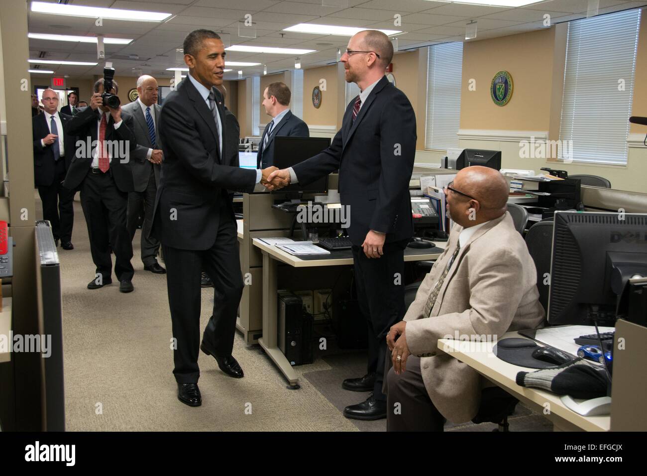 US President Barack Obama greets workers during a visit to Homeland ...