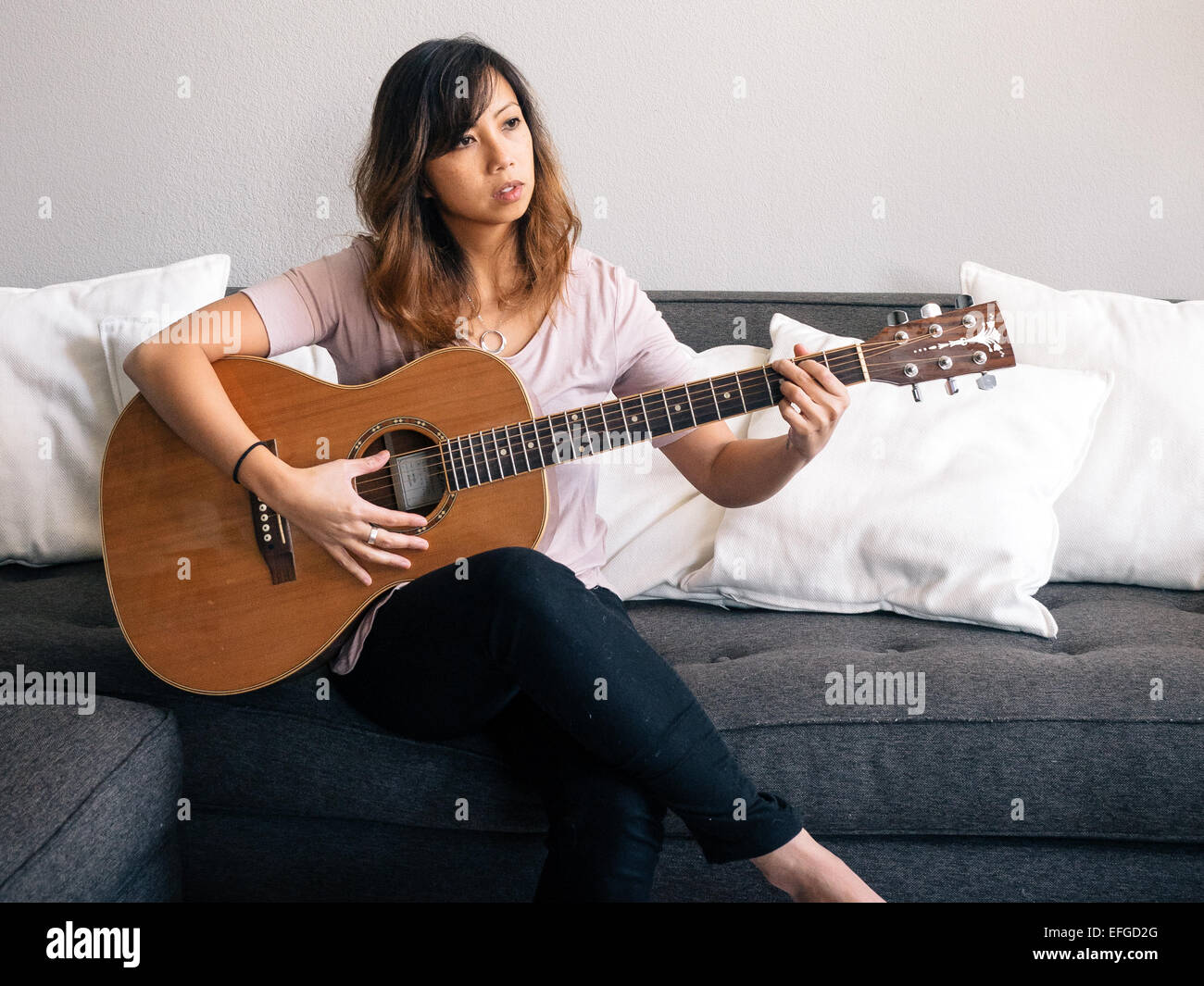 asian woman playing the guitar Stock Photo - Alamy