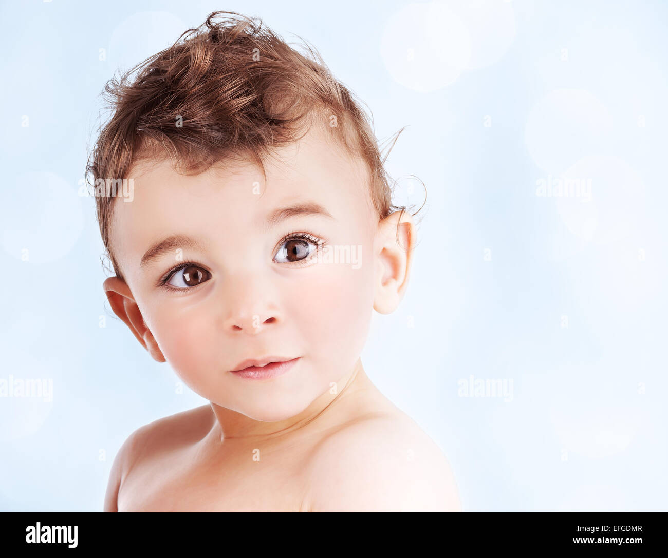 Cute baby boy over blue background, portrait with a copy space of an ...