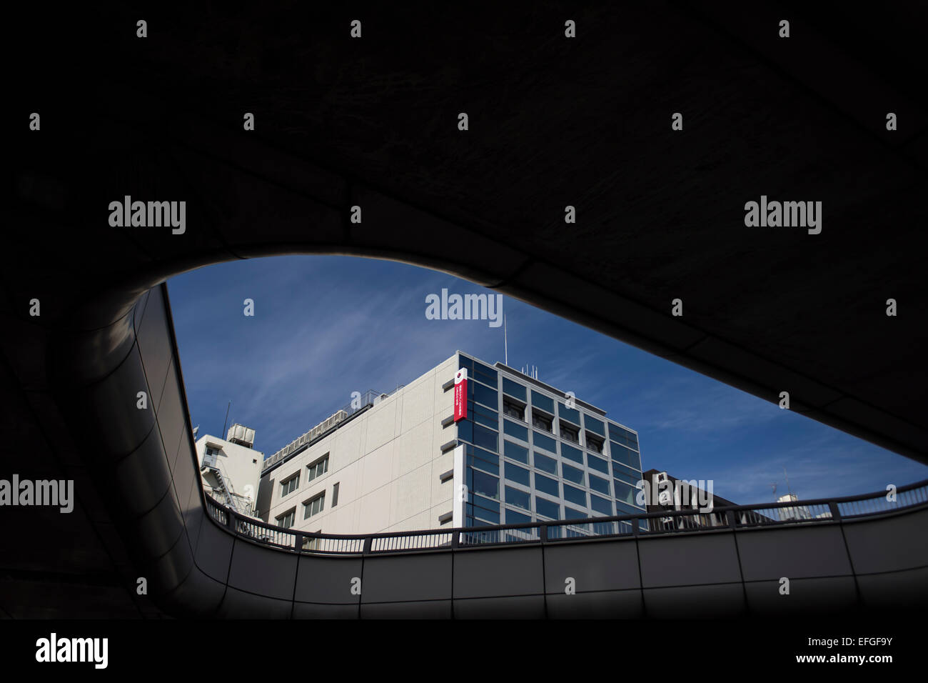 Office building and sky through road overpass in Ginza, Tokyo, Japan ...