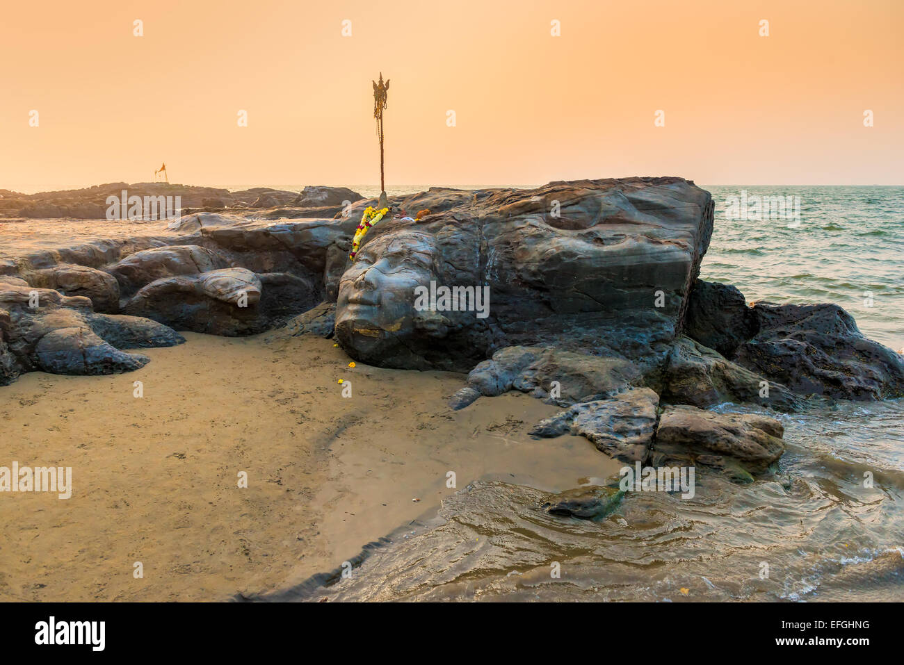 Shiva's face in the rock on the beach in Goa Stock Photo - Alamy