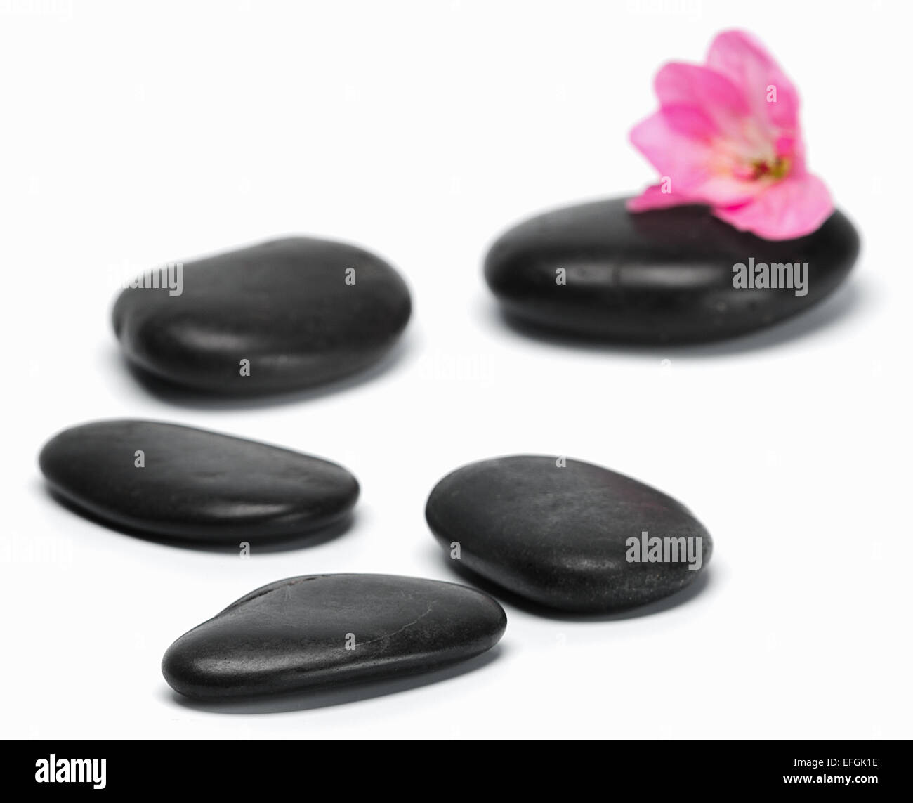 Spa stones on white background Stock Photo - Alamy