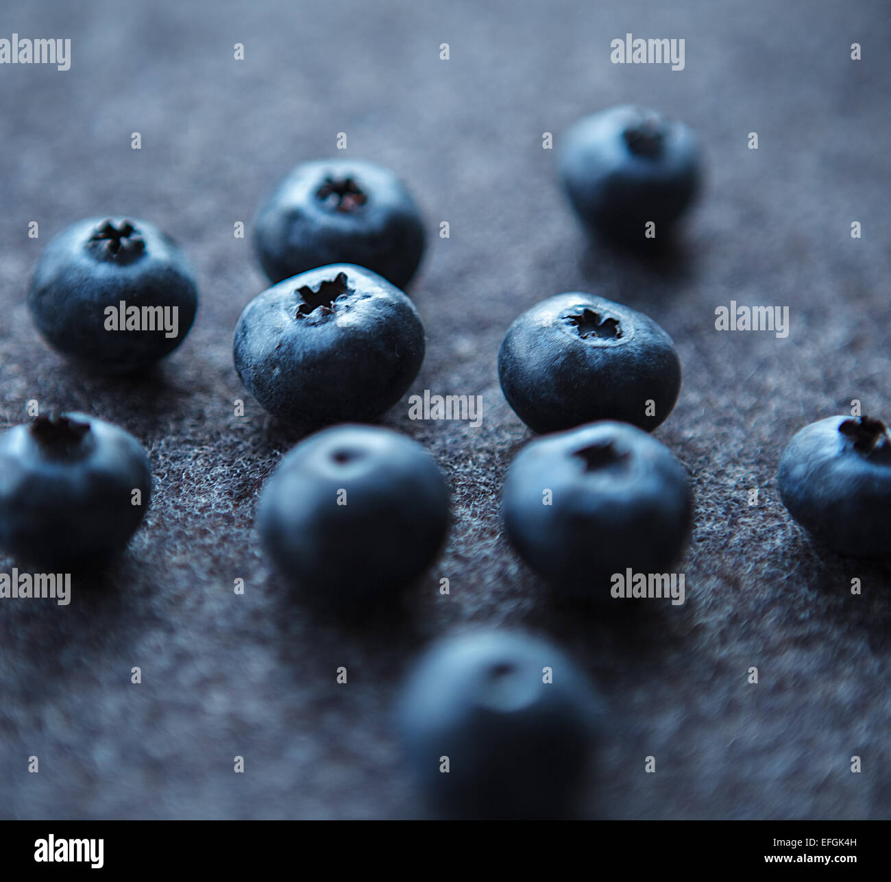 Blueberries, grey felt and linen as background Stock Photo - Alamy