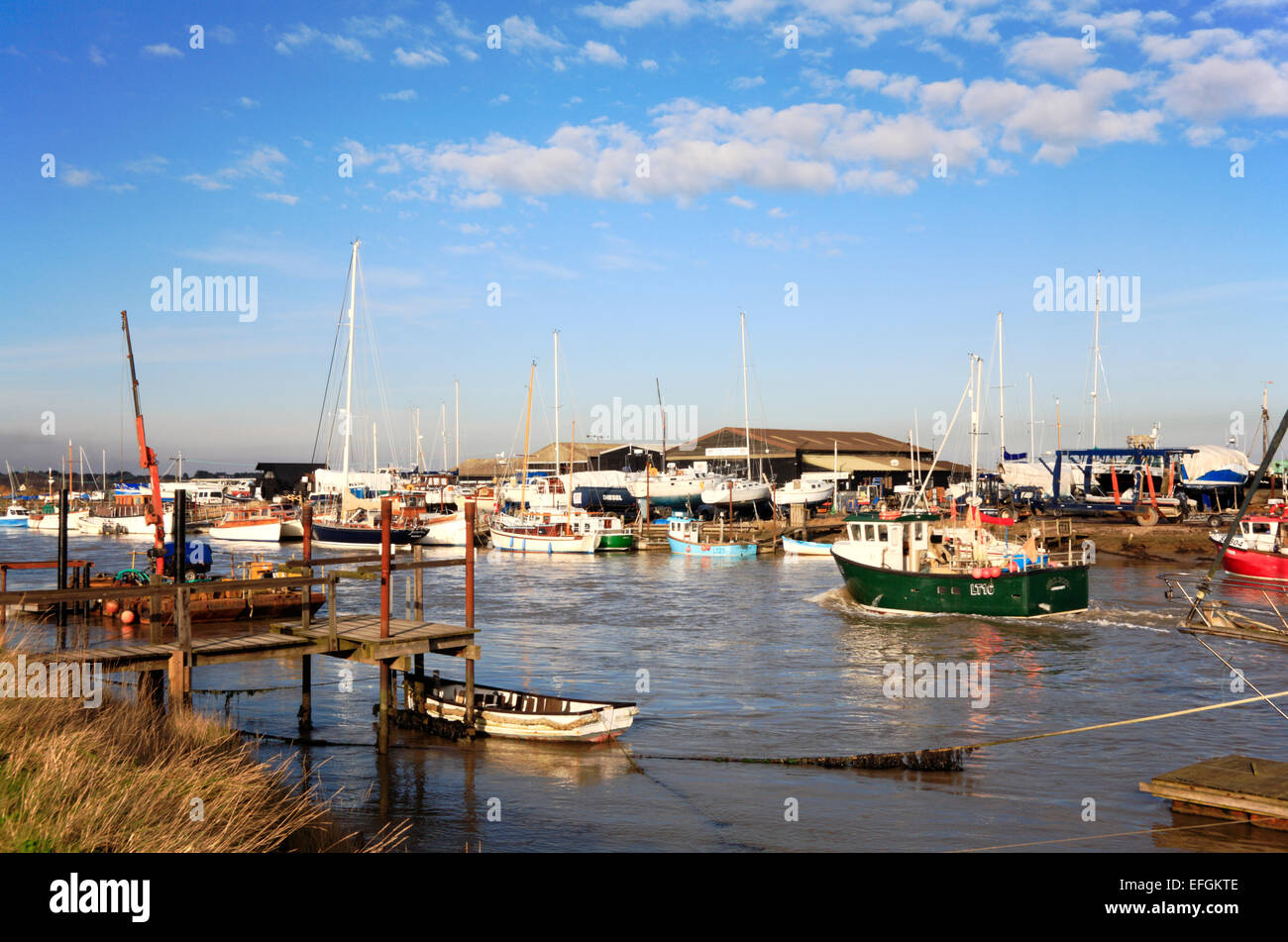 A view of an inshore fishing boat returning to port at Southwold ...