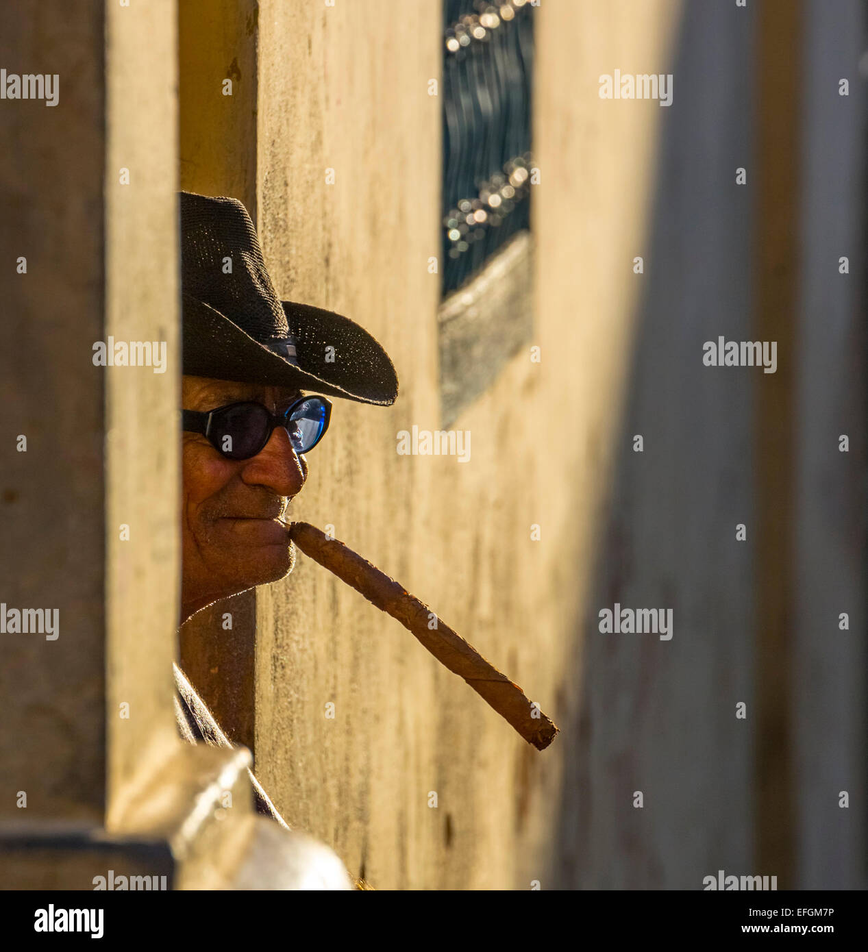 Cuban man smoking a cigar in trinidad hi-res stock photography and ...