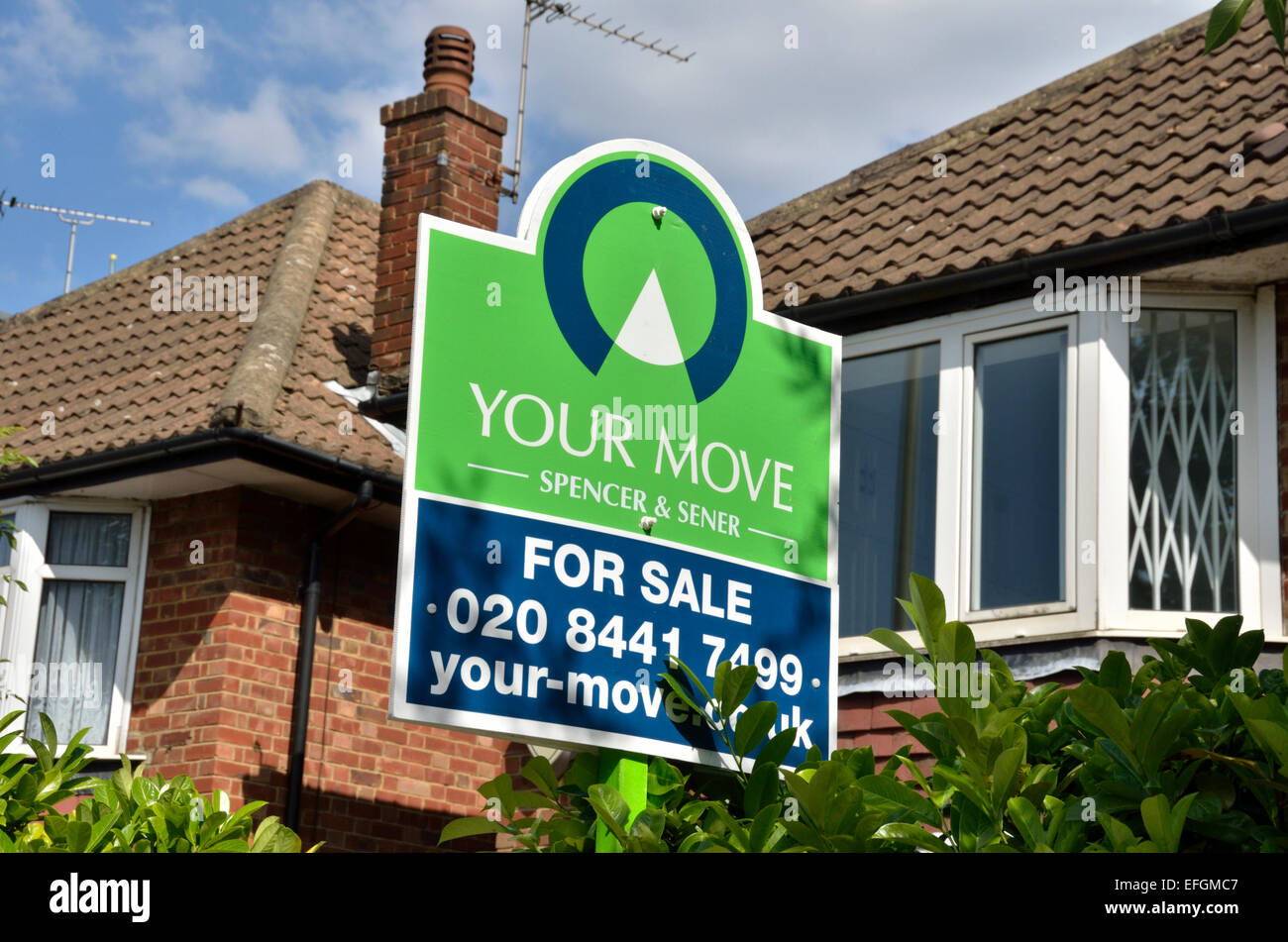 Your Move estate agents sign outside a house, London, UK Stock Photo ...