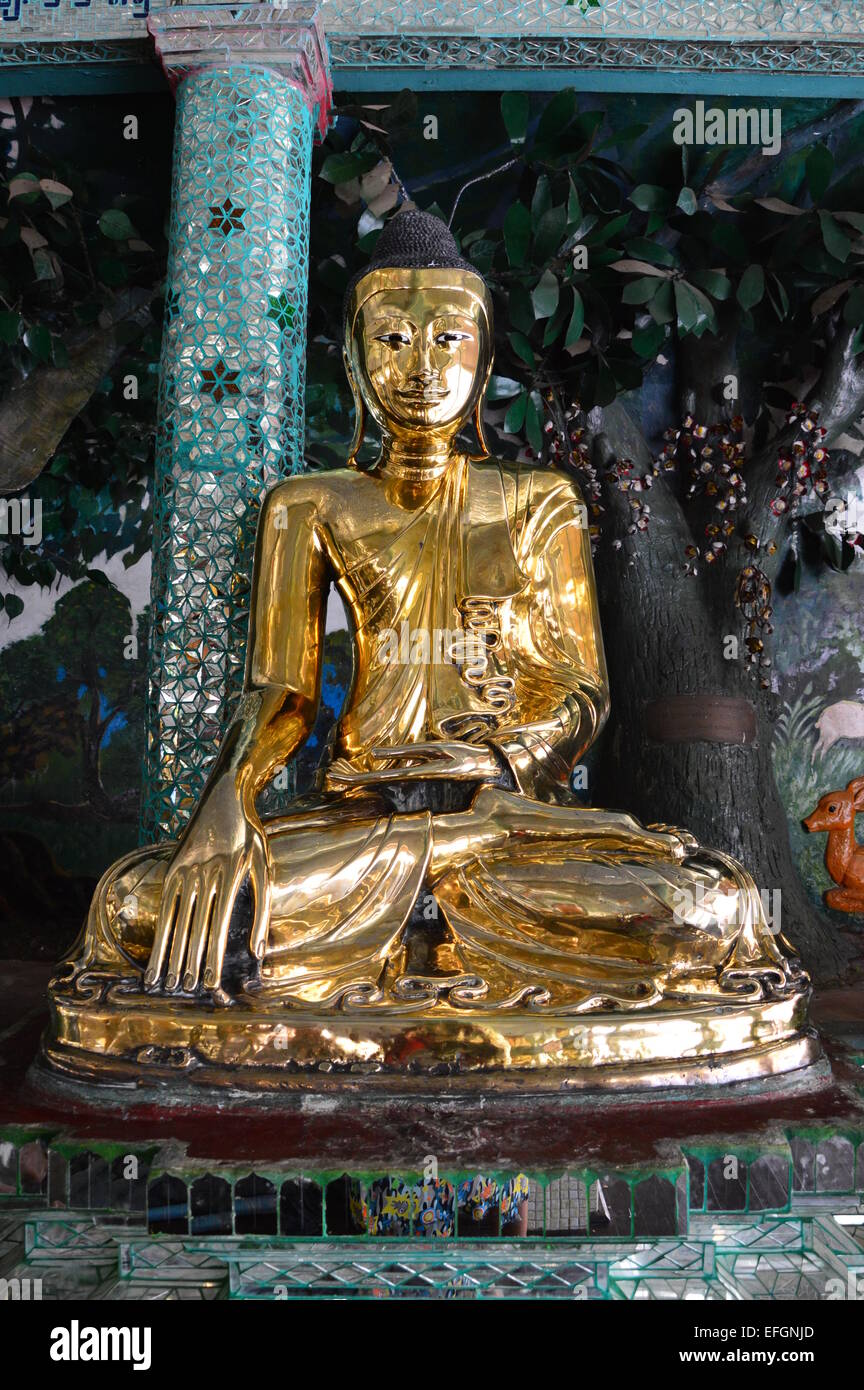 Golden mystic Buddha statue Stock Photo - Alamy