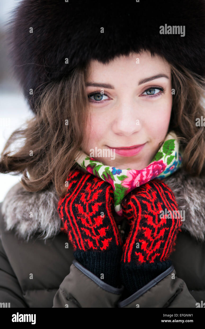 A portrait of young woman in a warm clothing Stock Photo - Alamy