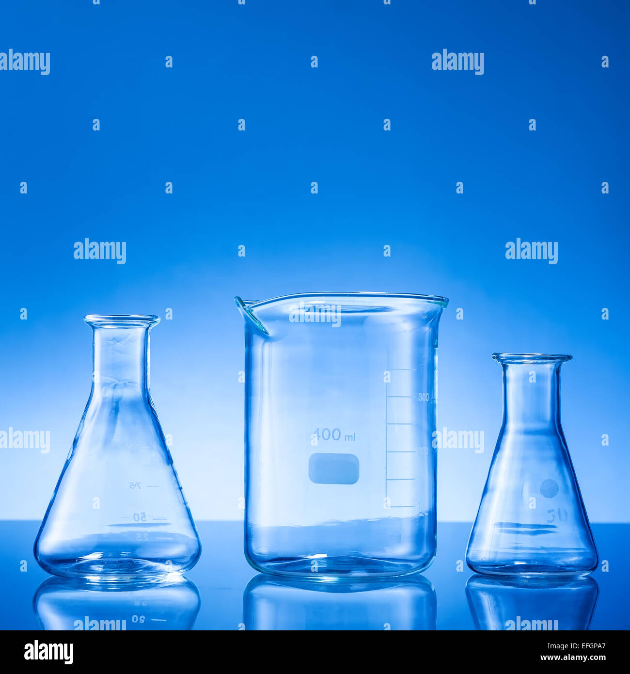 Laboratory equipment on blue background Stock Photo - Alamy