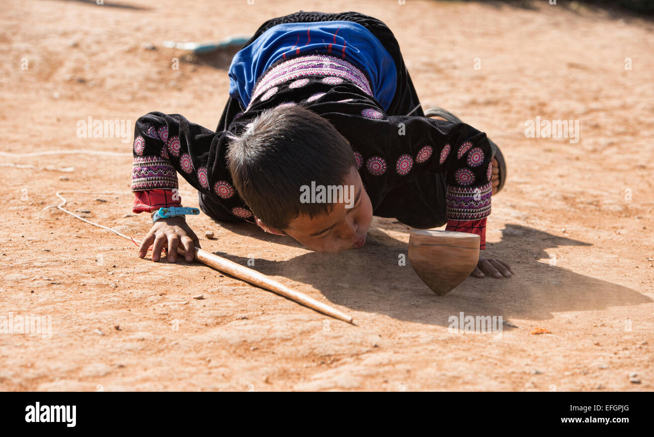 Hmong boy and his wooden top in Mon Jam, Chiang Mai, Thailand Stock ...