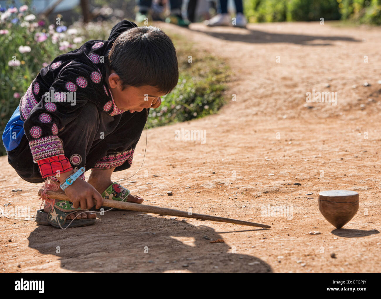 Hmong boy and his wooden top in Mon Jam, Chiang Mai, Thailand Stock ...