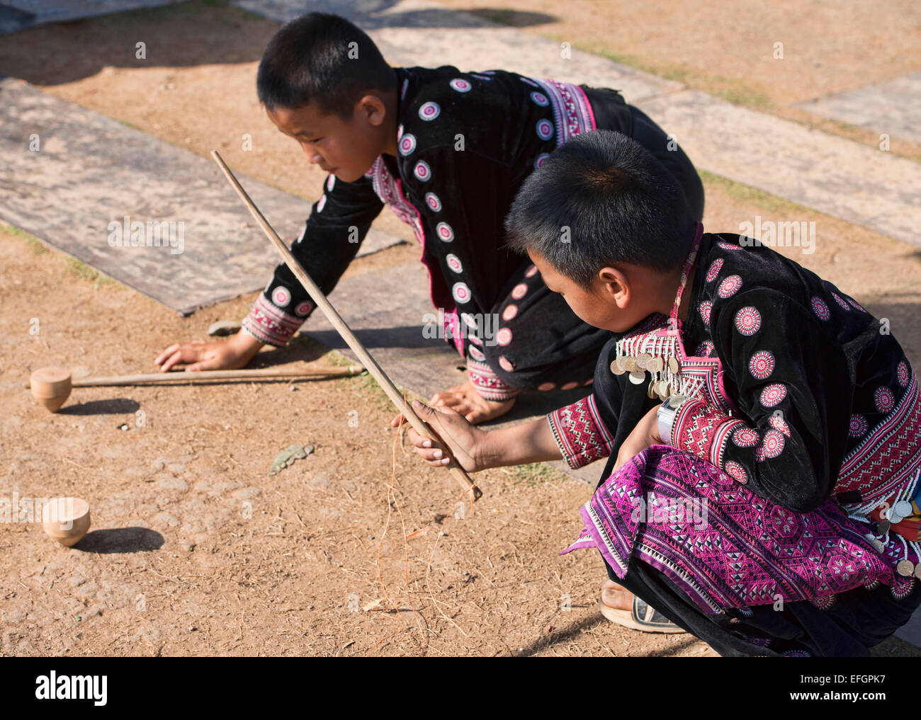 Hmong boys and their wooden tops in Mon Jam, Chiang Mai, Thailand Stock ...