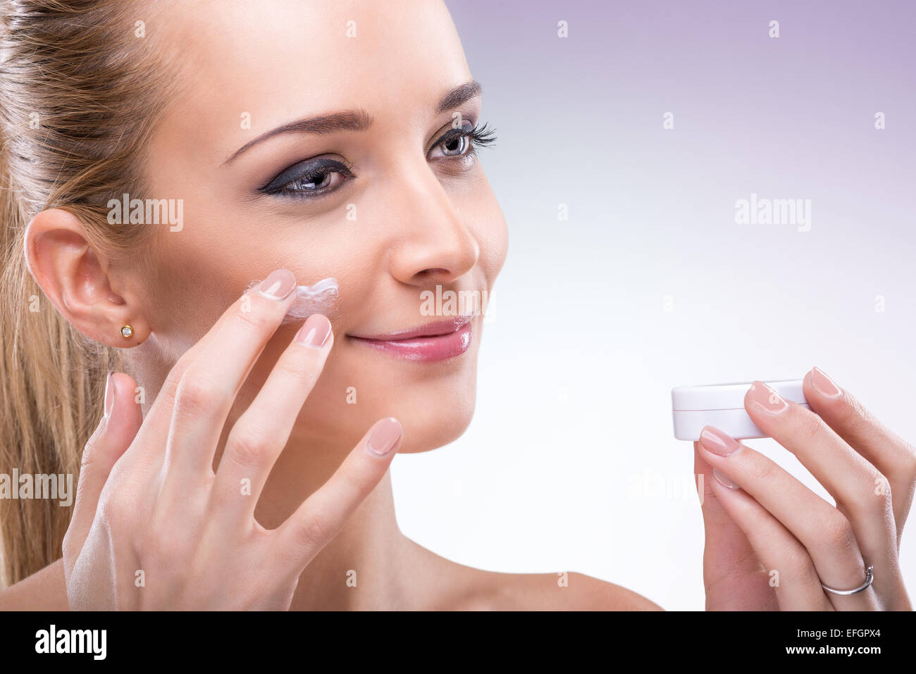 Woman with face cream Stock Photo - Alamy