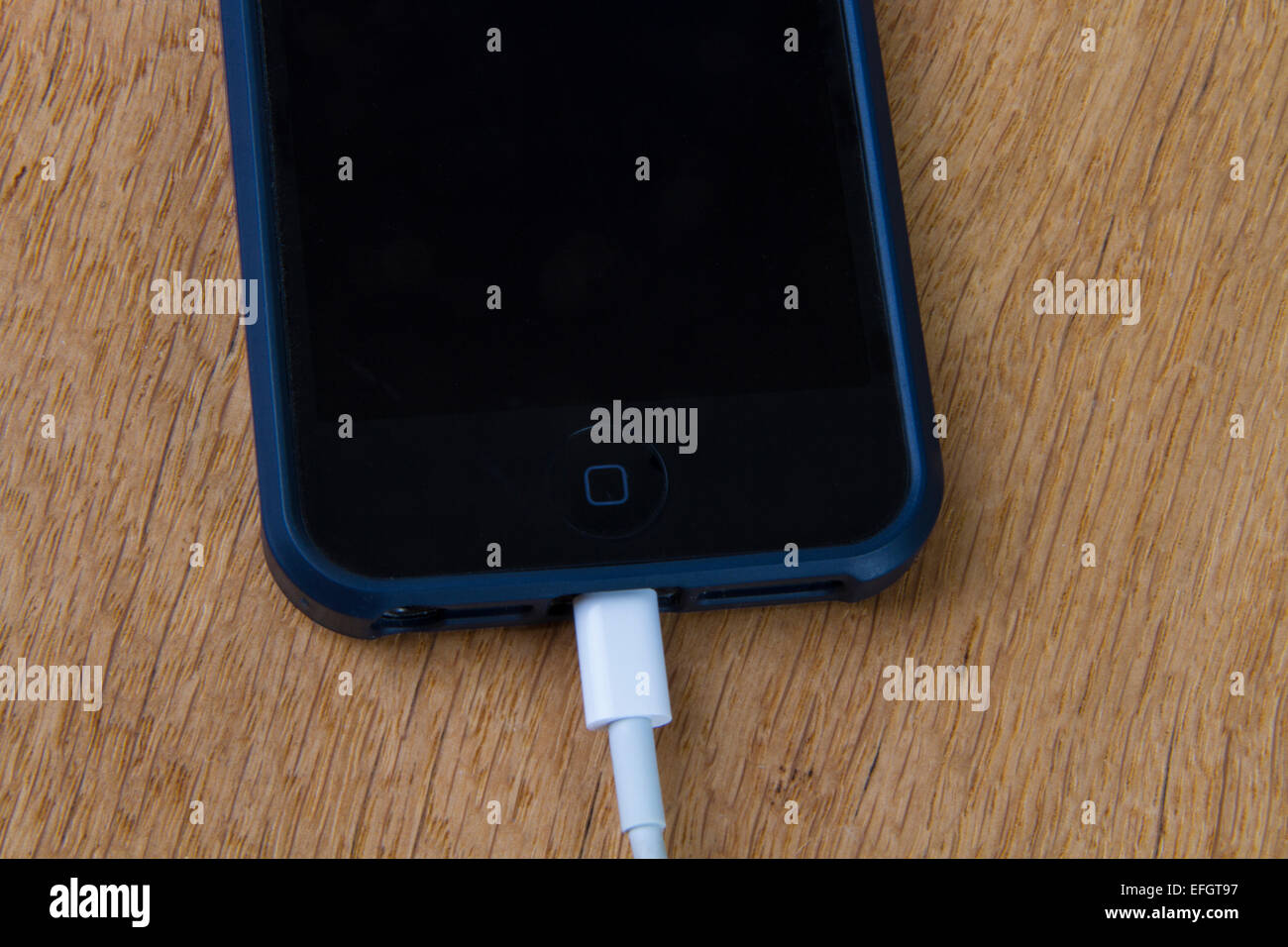 Apple iPhone mobile phone being charged Stock Photo - Alamy
