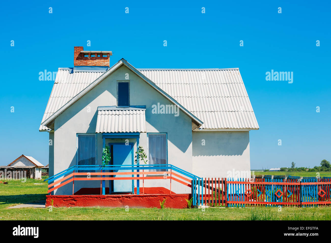 Country House With Colorful Fence. Rural Village In Summer Sunny Day ...