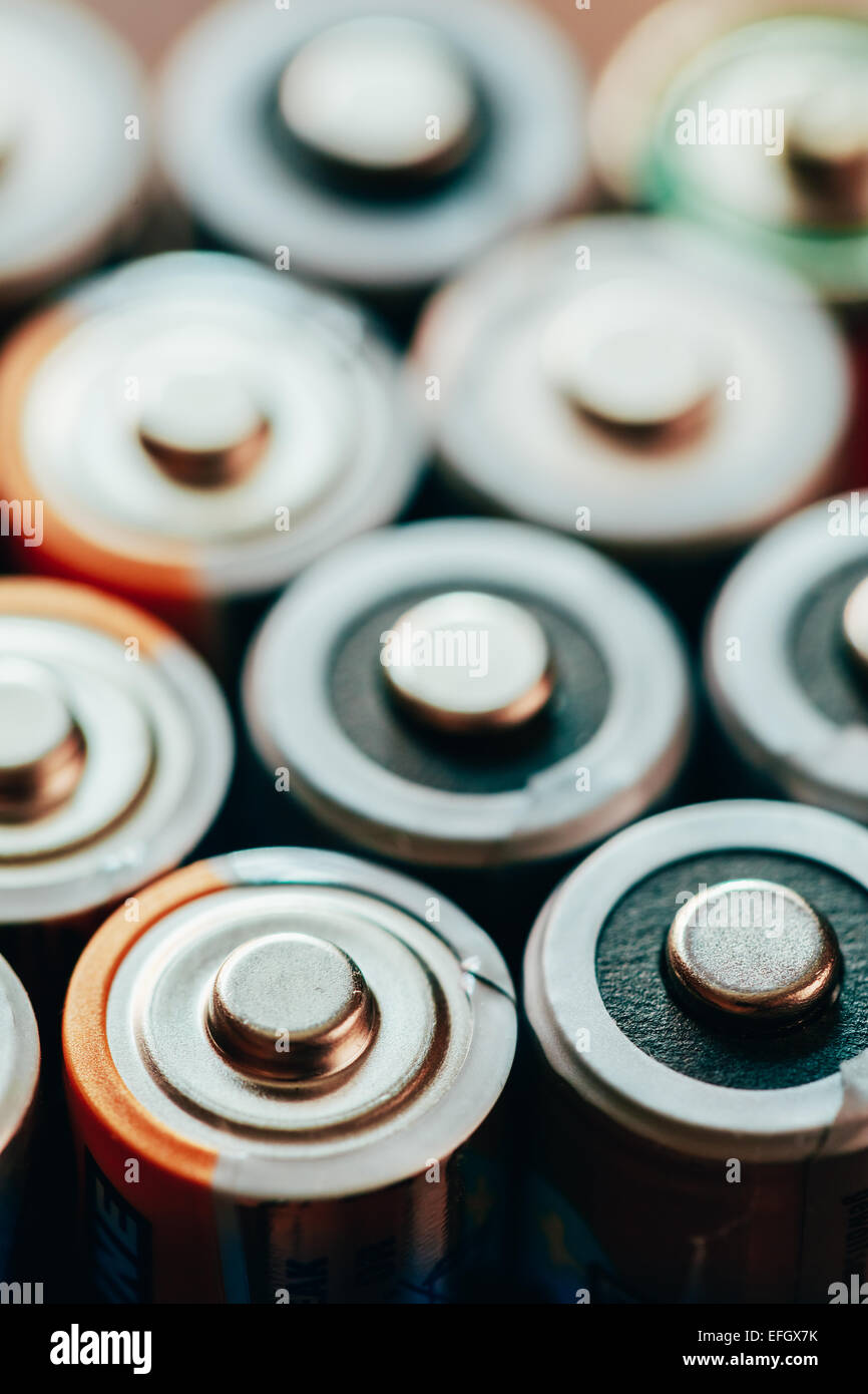 Several AA batteries closeup view background Stock Photo - Alamy