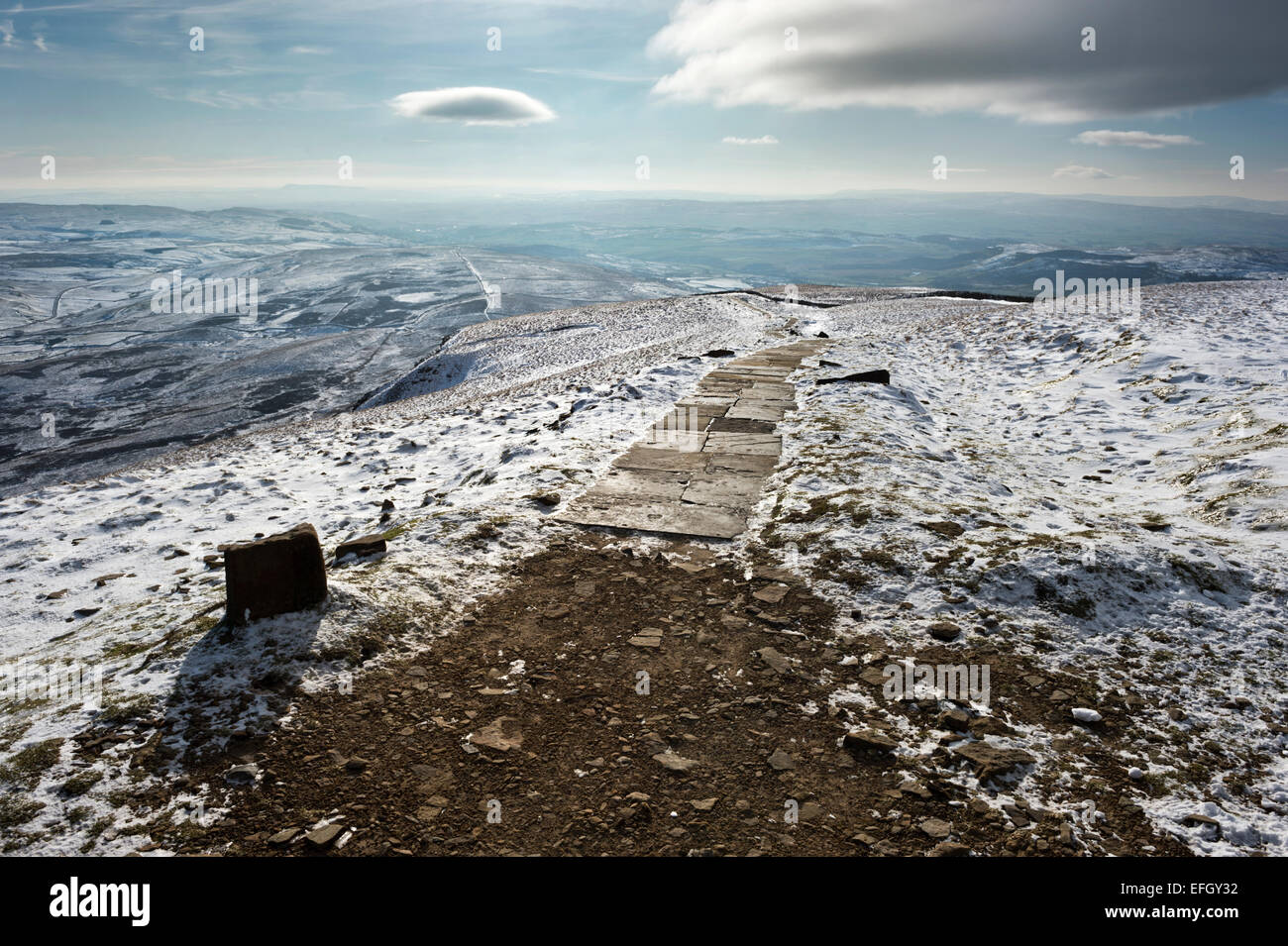 Winter view of the Pennine Way trail looking south on the summit of Pen ...