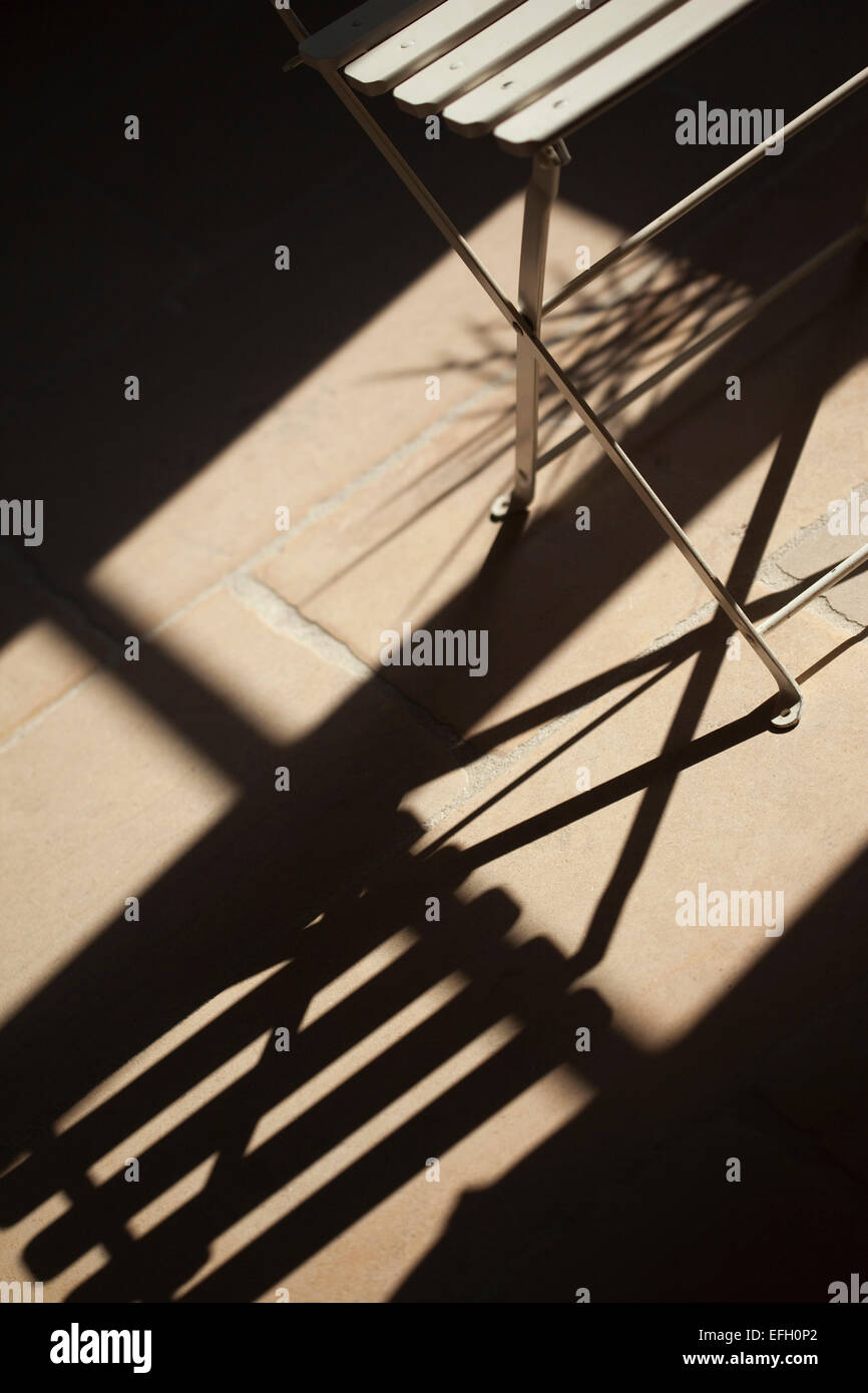 Shadows and chairs on a terrace Stock Photo - Alamy