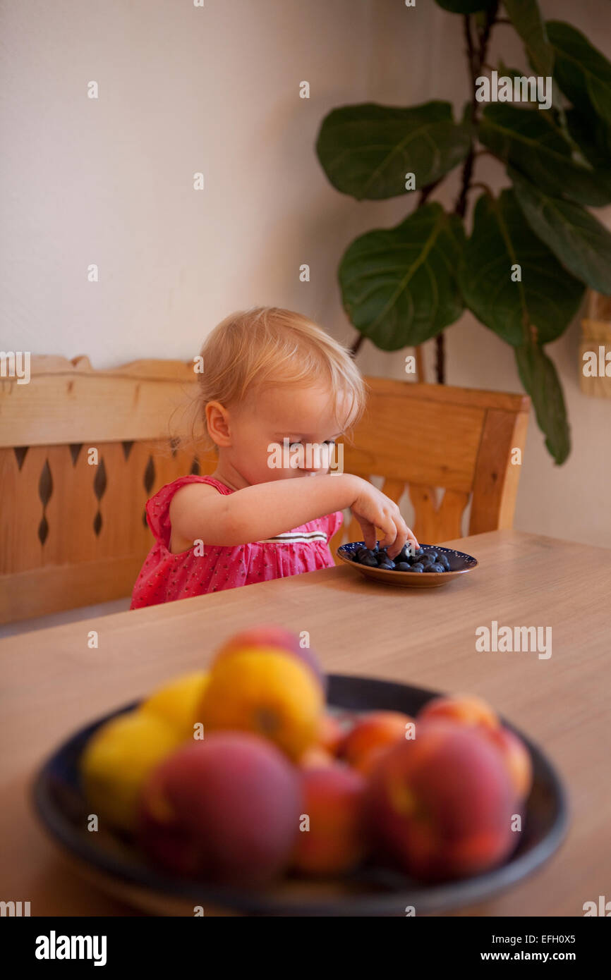 Kid tasting berries hi-res stock photography and images - Alamy