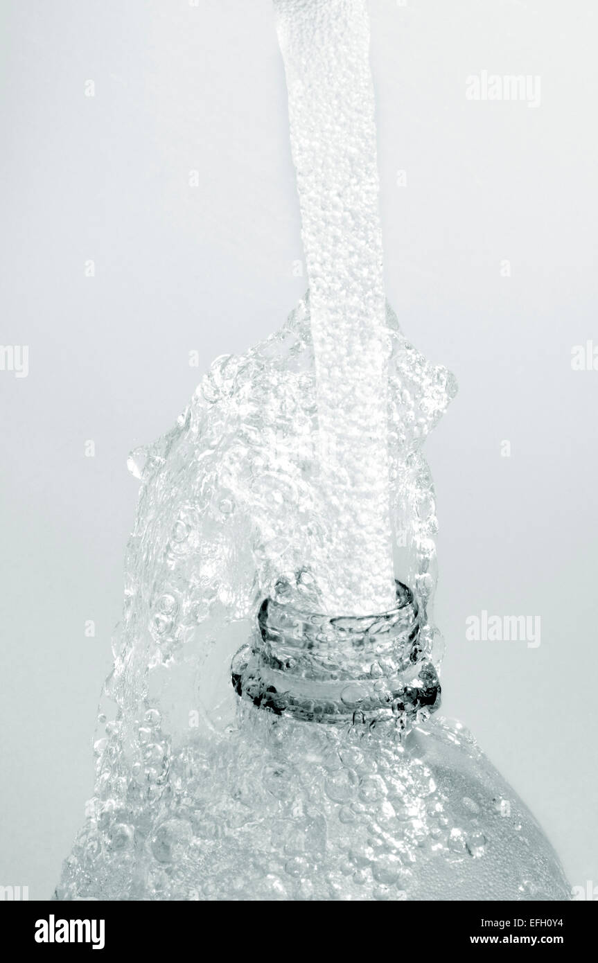 Water being poured from a bottle Stock Photo - Alamy